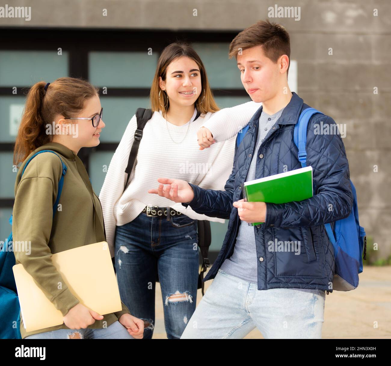Teenage students talking outside after lessons Stock Photo - Alamy