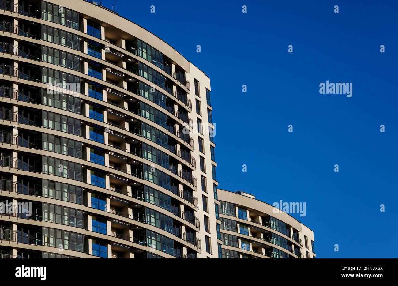 facade of a modern residential building against the blue sky. mortgage ...