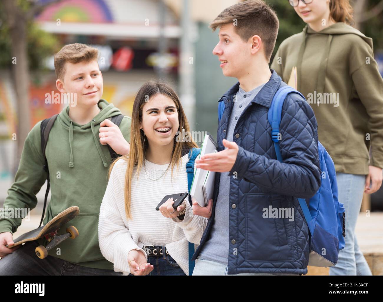 Teenage students talking outside after lessons Stock Photo - Alamy