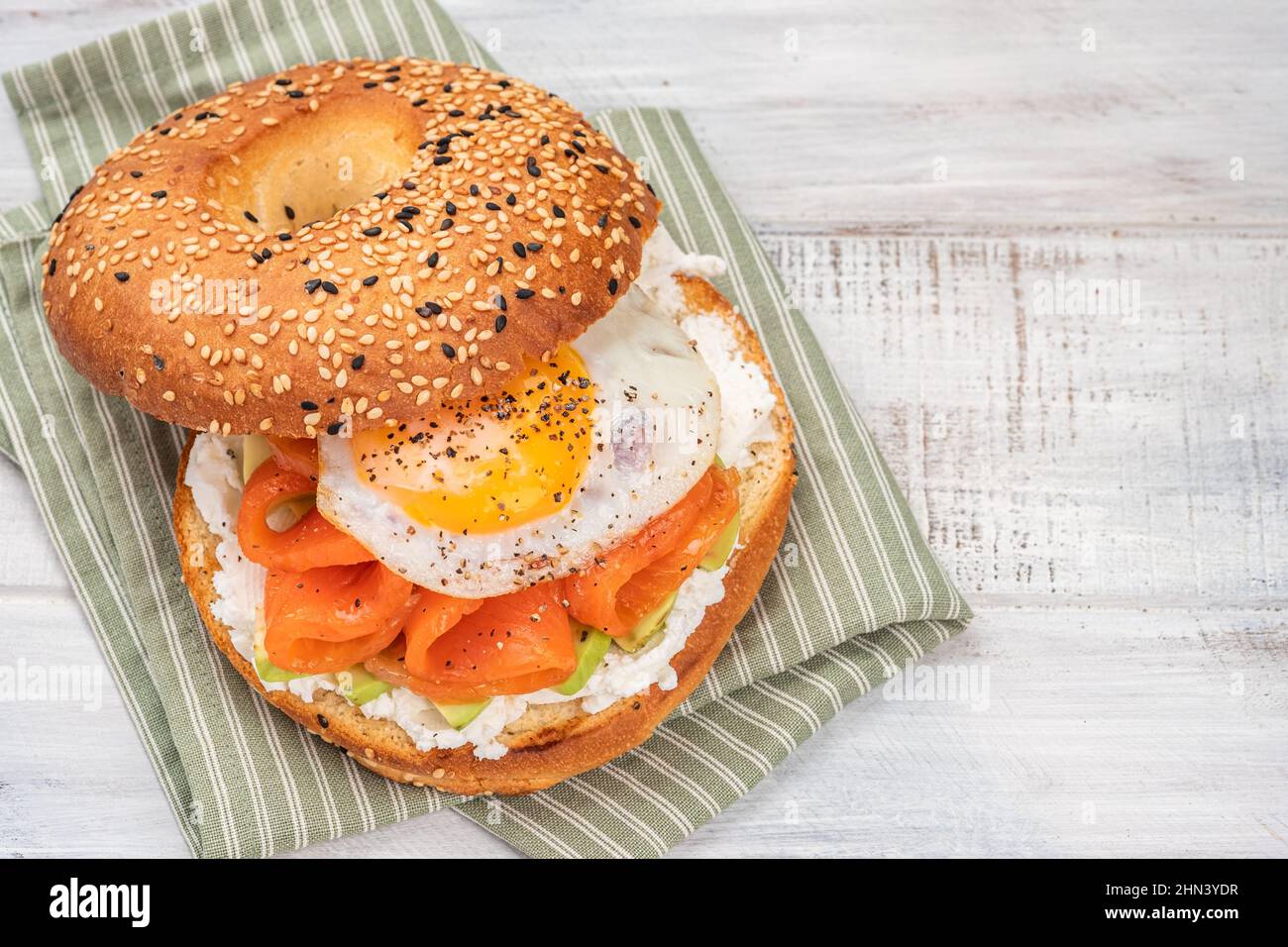 Bagel sandwich with smoked salmon, cream cheese, avocado and egg Stock ...