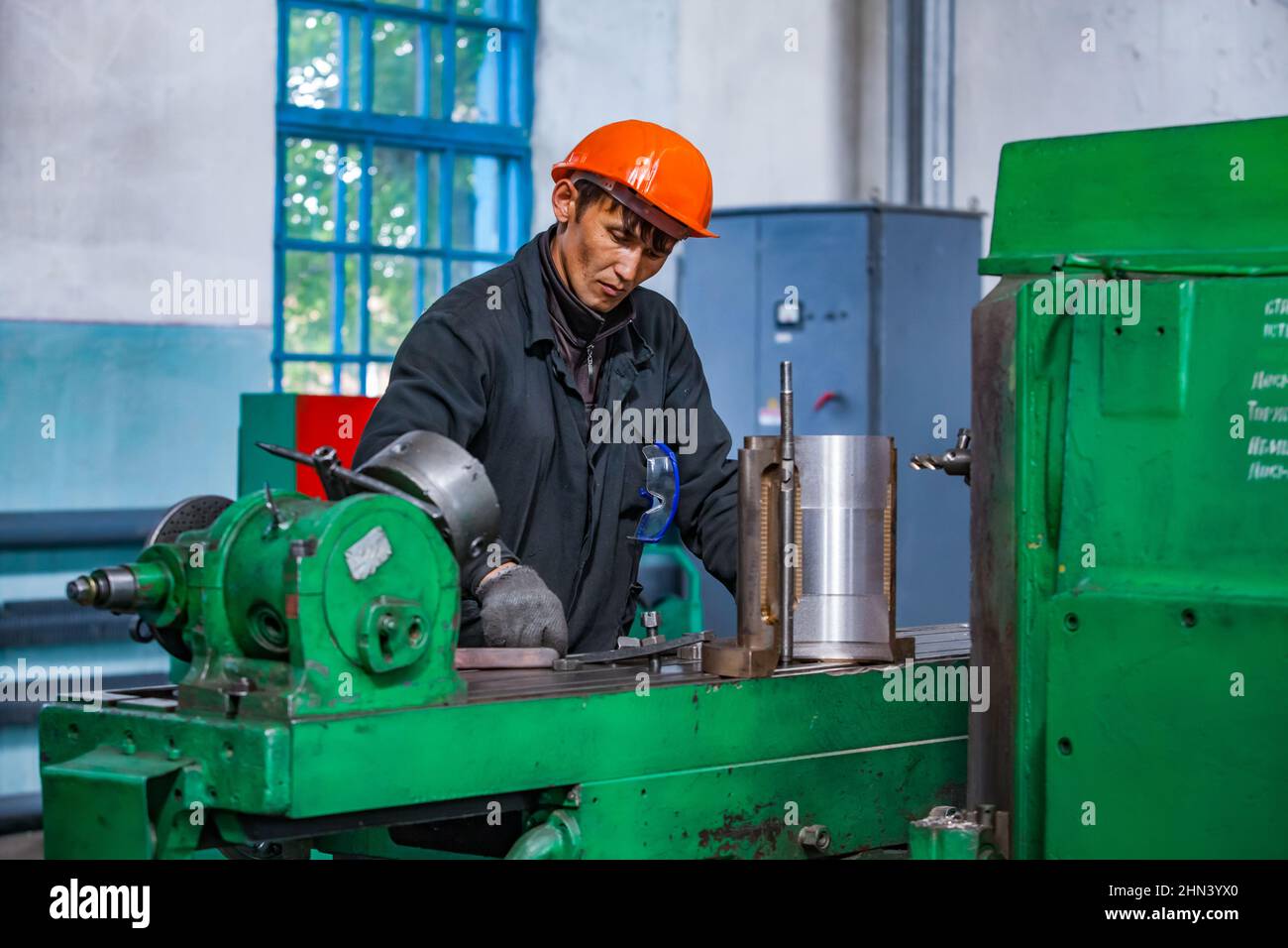 Kazaly, Kazakhstan - May 02, 2012: Locomotive repair plant. Young Asian ...