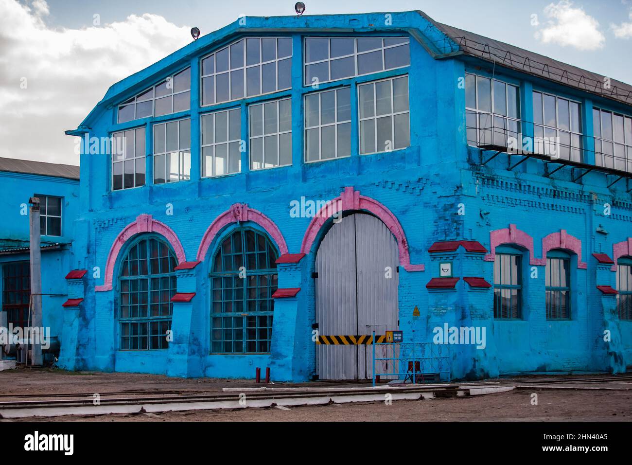 Vintage locomotive repair plant depot main building. Train gates and ...