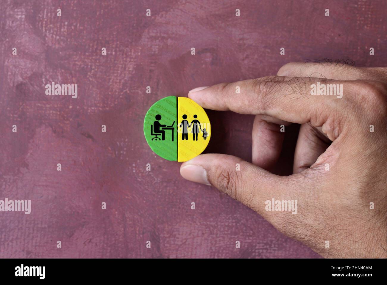 Work and family balance concept. Top view image of hand and wooden ...