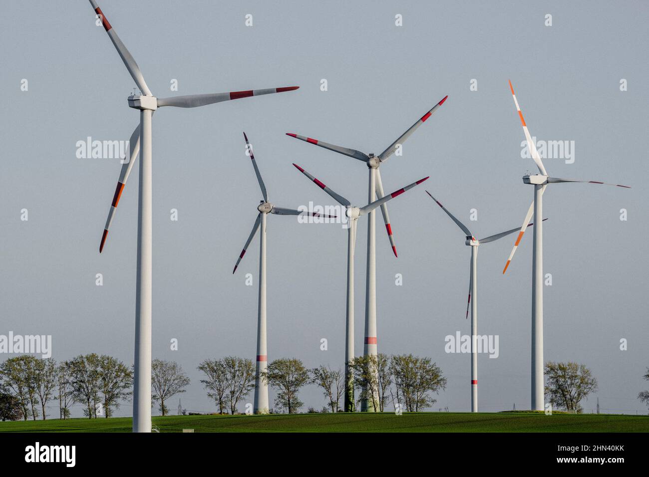 Wind turbine farms against sunny blue sky, Germany Stock Photo - Alamy