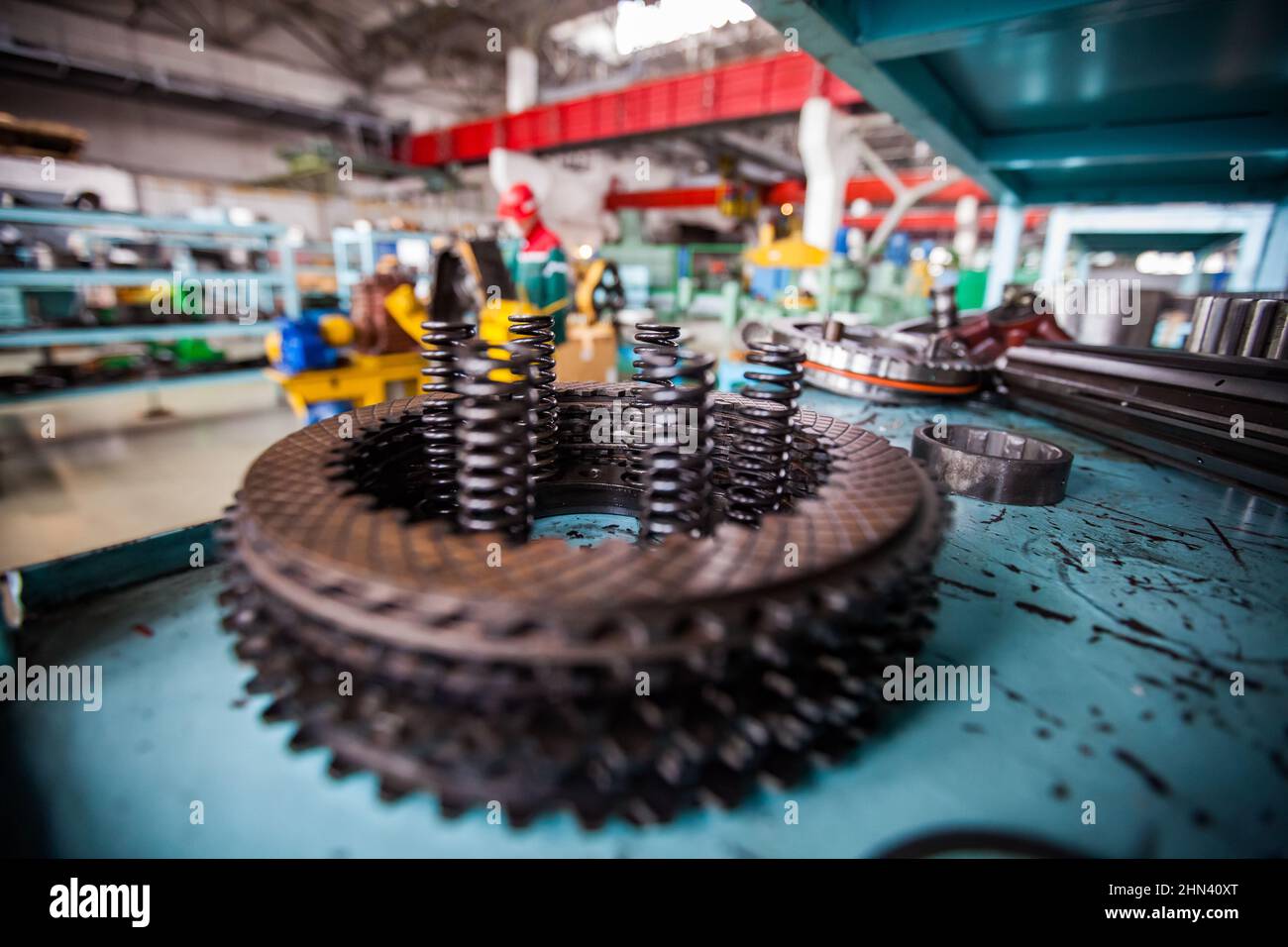 Truck-repairing plant. Close up photo of steel transmission part with ...