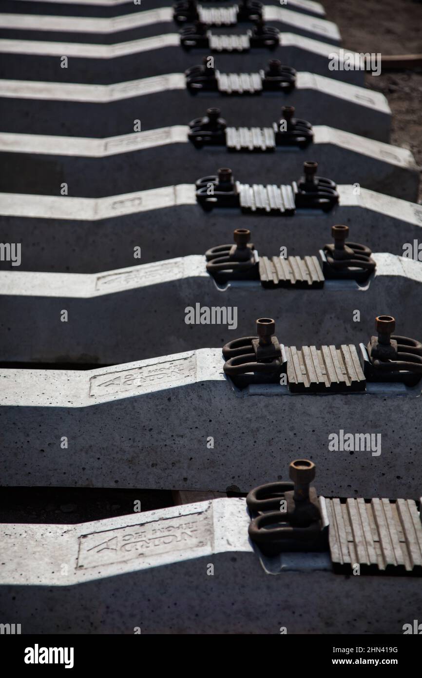 Concrete sleepers with metal bolts and furniture and rubber. Close-up ...