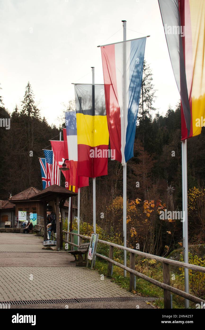 Flags on a walking path leading up to the Triberg waterfall on a fall ...