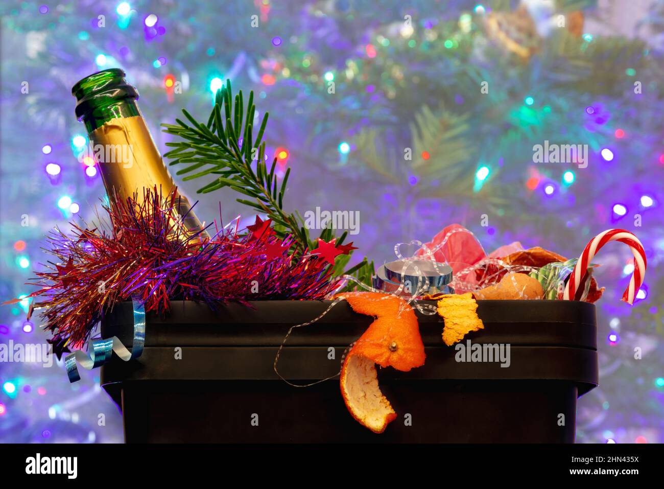 After christmas garbage dump food christmas tree branch empty bottle ...