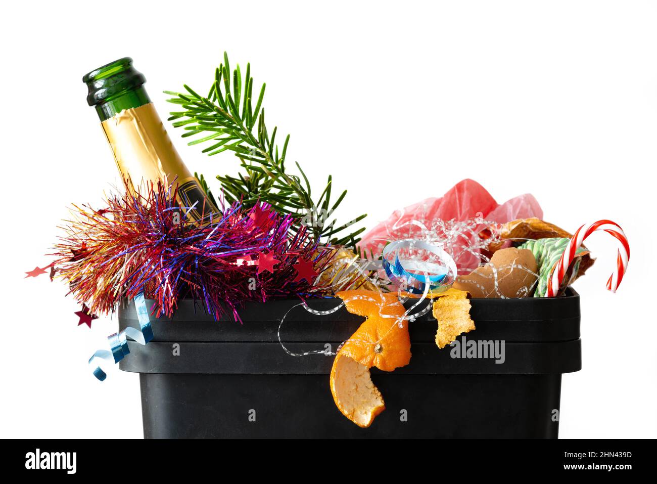 After christmas garbage dump food christmas tree branch empty bottle ...