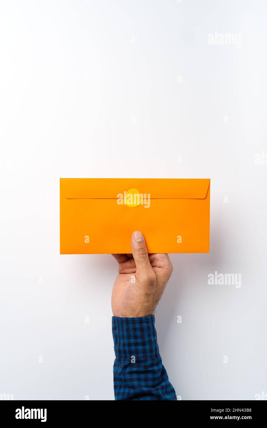 African American Hand Holding Envelope