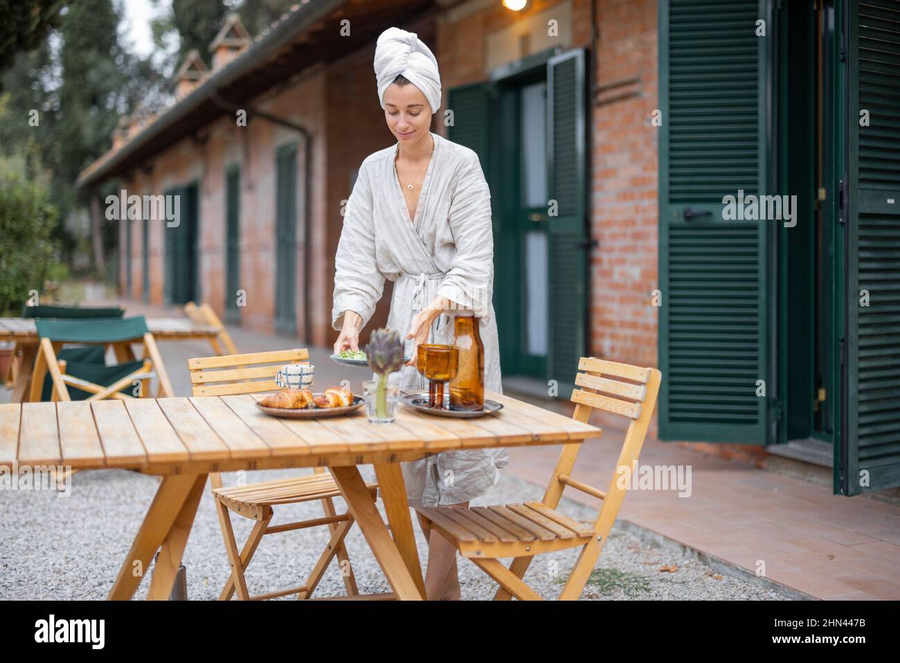 Woman carry food to table for breakfast at morning Stock Photo - Alamy