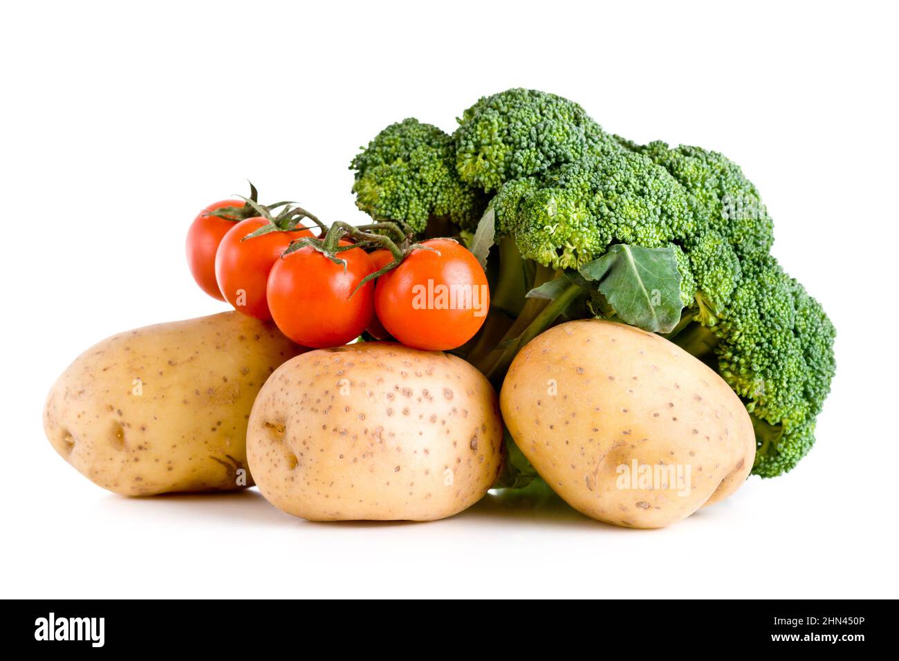 Fresh vegetables, broccoli, tomato and potatoesisolated on white Stock ...