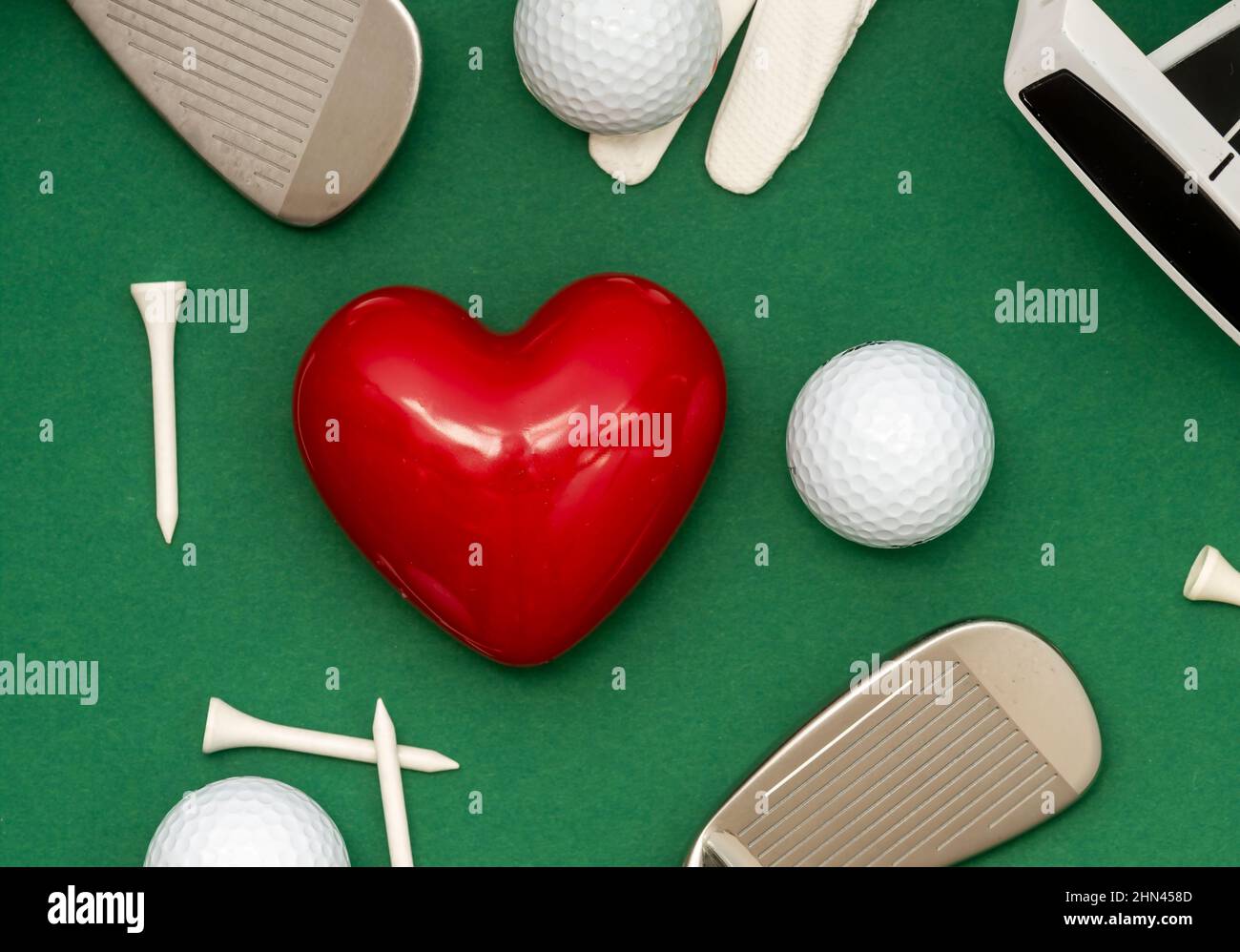 I love golf concept with golf ball and heart and tee on green Stock ...
