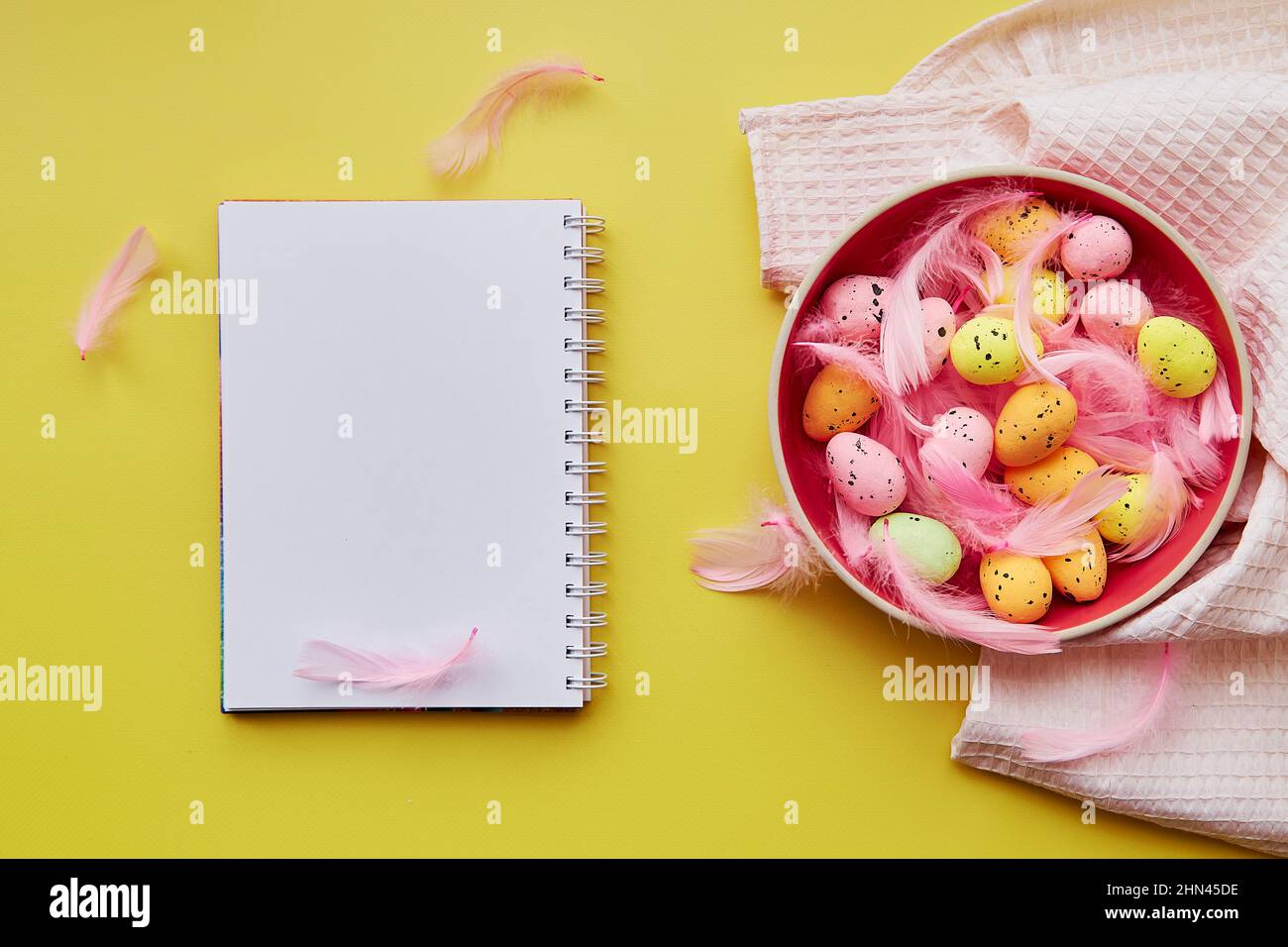 Creative Easter notepad mock up on yellow background. Decorated Easter ...