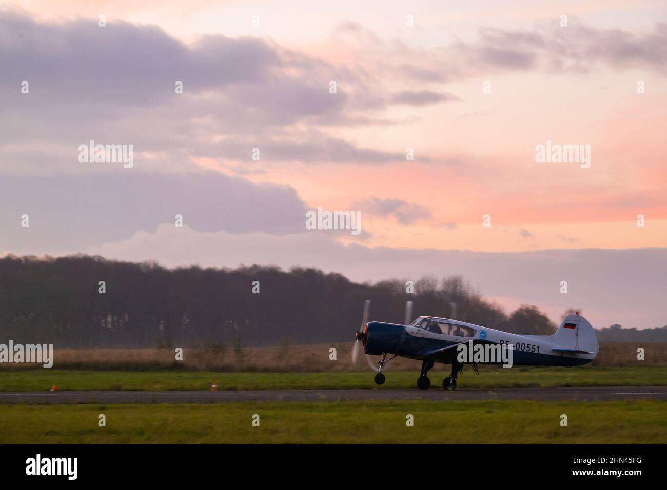 Plane with propeller at sunset Stock Photo - Alamy