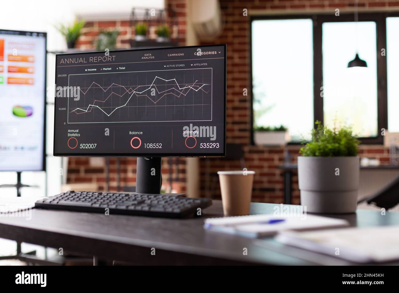 Close up of monitor with company growth analysis on office desk ...