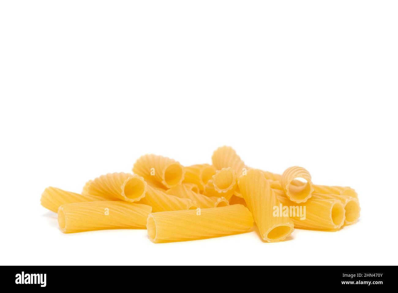 Uncooked short tubes shape pasta also known as tortiglioni or ...
