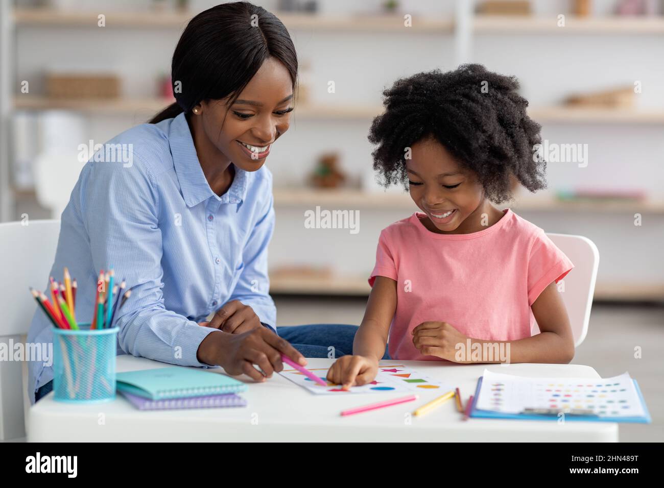 Smiling kid preschooler visiting child psychologist, doing test Stock ...
