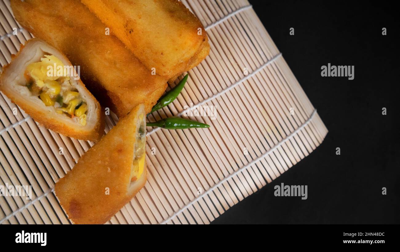 close up sliced Indonesian Rissoles on a black background Stock Photo ...