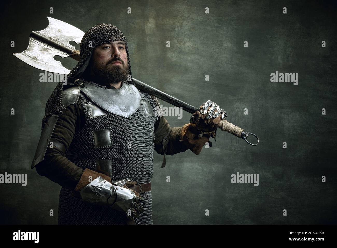 Vintage portrait of brutal seriuos man, medieval warrior or knight with ...