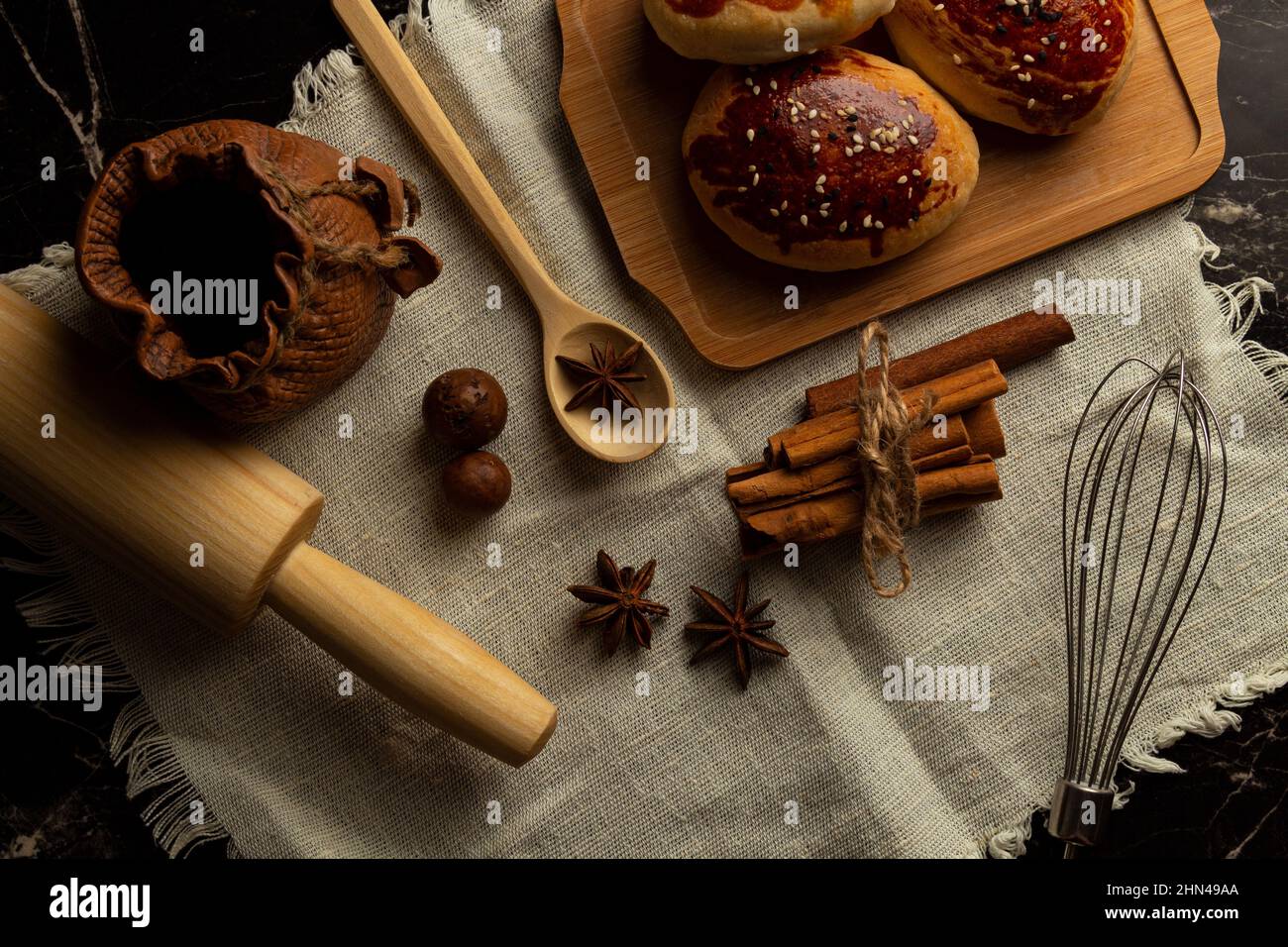 Fresh pies are ready to eat and lie surrounded by kitchen utensils ...