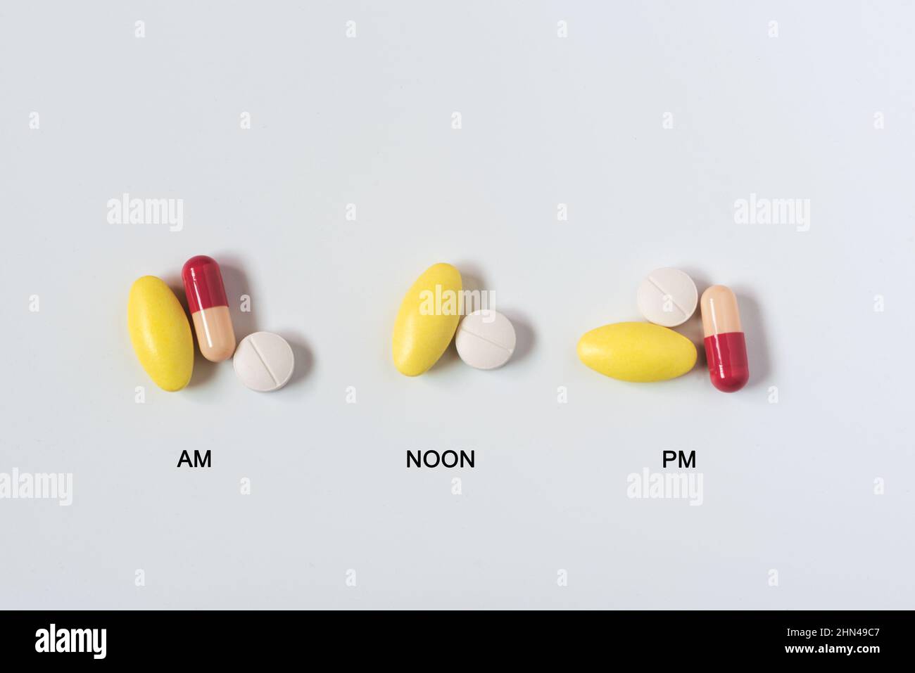 Medications on white background taking three times a day, in the ...