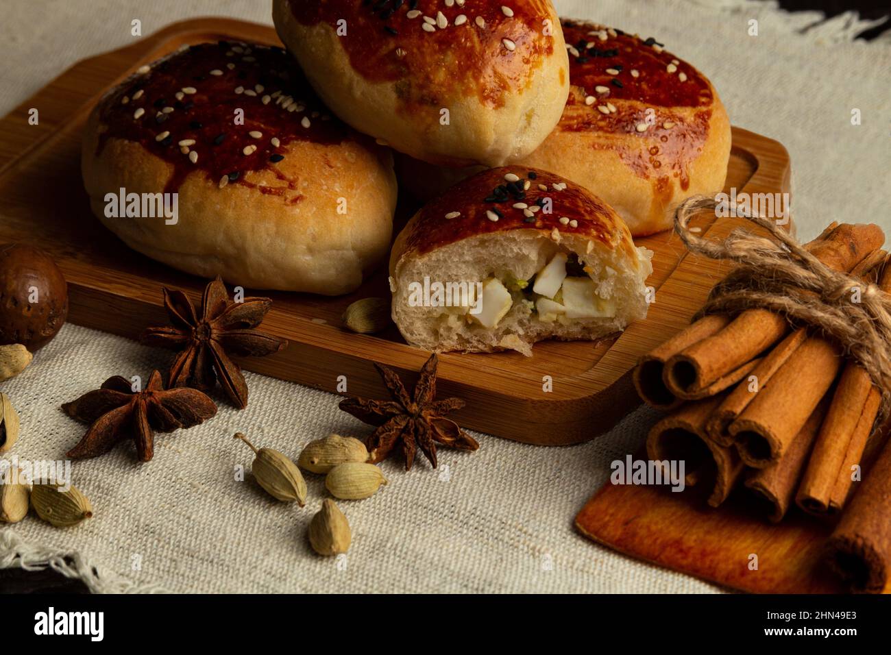 Fresh beautiful and tasty pies are ready to eat and lie surrounded by ...