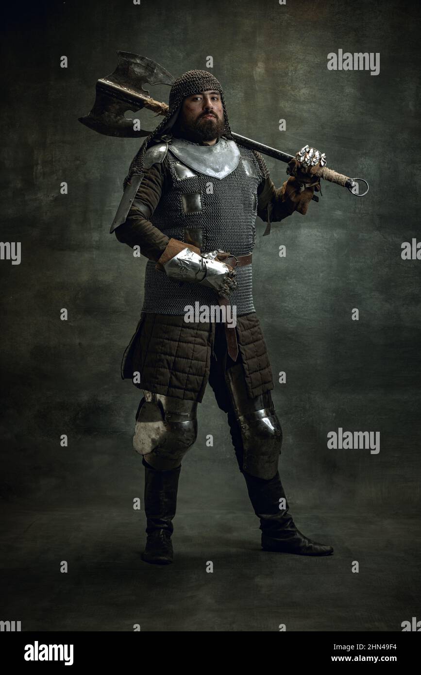 Vintage portrait of brutal seriuos man, medieval warrior or knight with ...