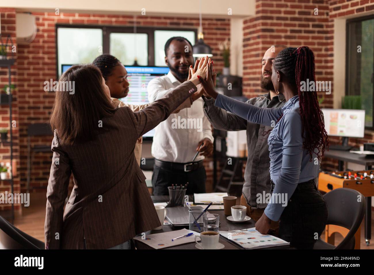 Happy excited businessteam rising hands celebrating business ...