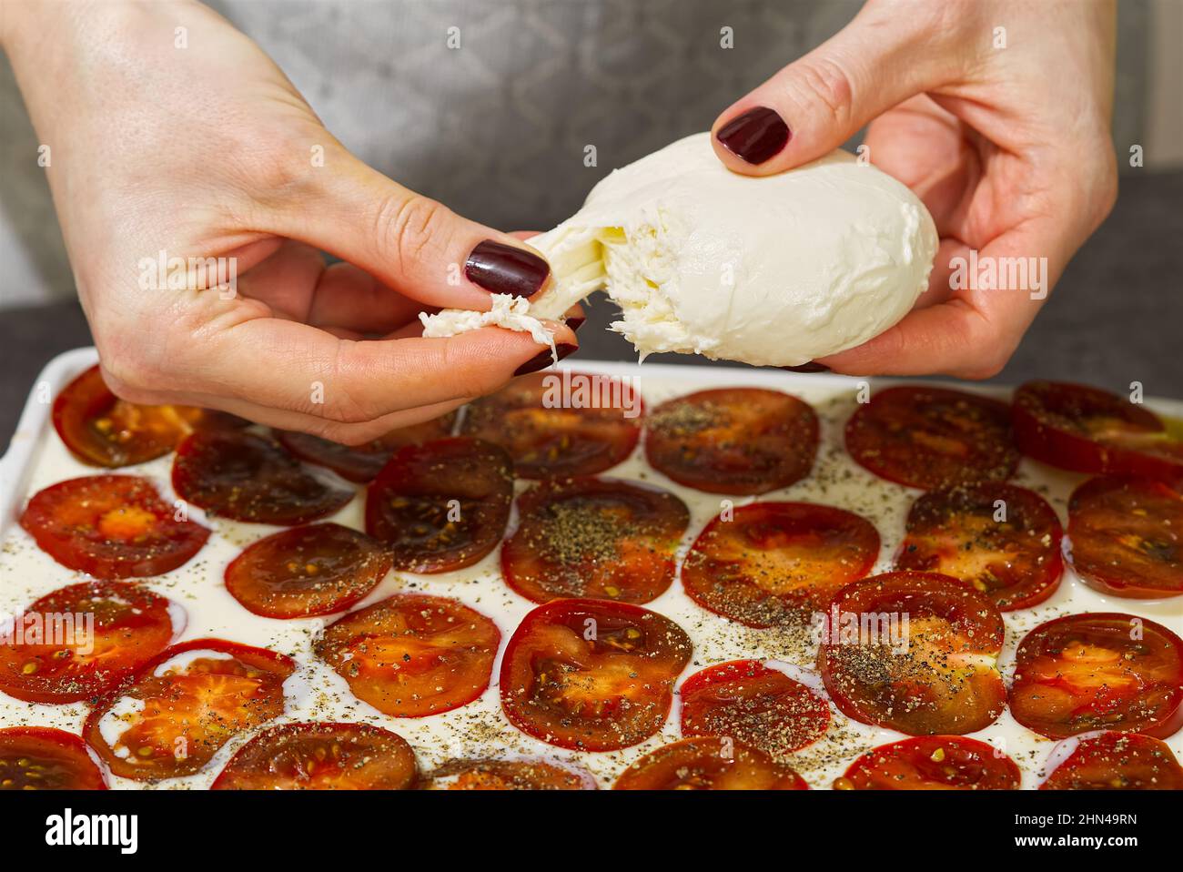 Woman preparing meat lasagna in kitchen. lasagna recipe - Italian food ...