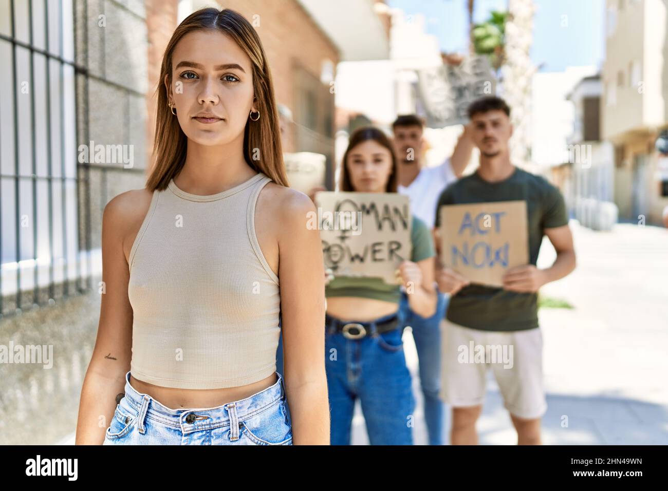 Group of people protesting and giving slogans at the street thinking ...