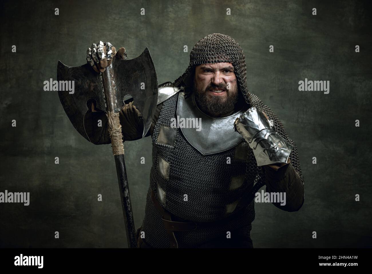 Vintage portrait of brutal seriuos man, medieval warrior or knight with ...