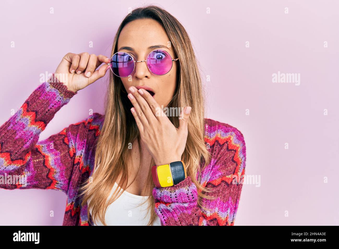 Beautiful Hispanic Woman Wearing Bohemian And Hippie Style With Pink