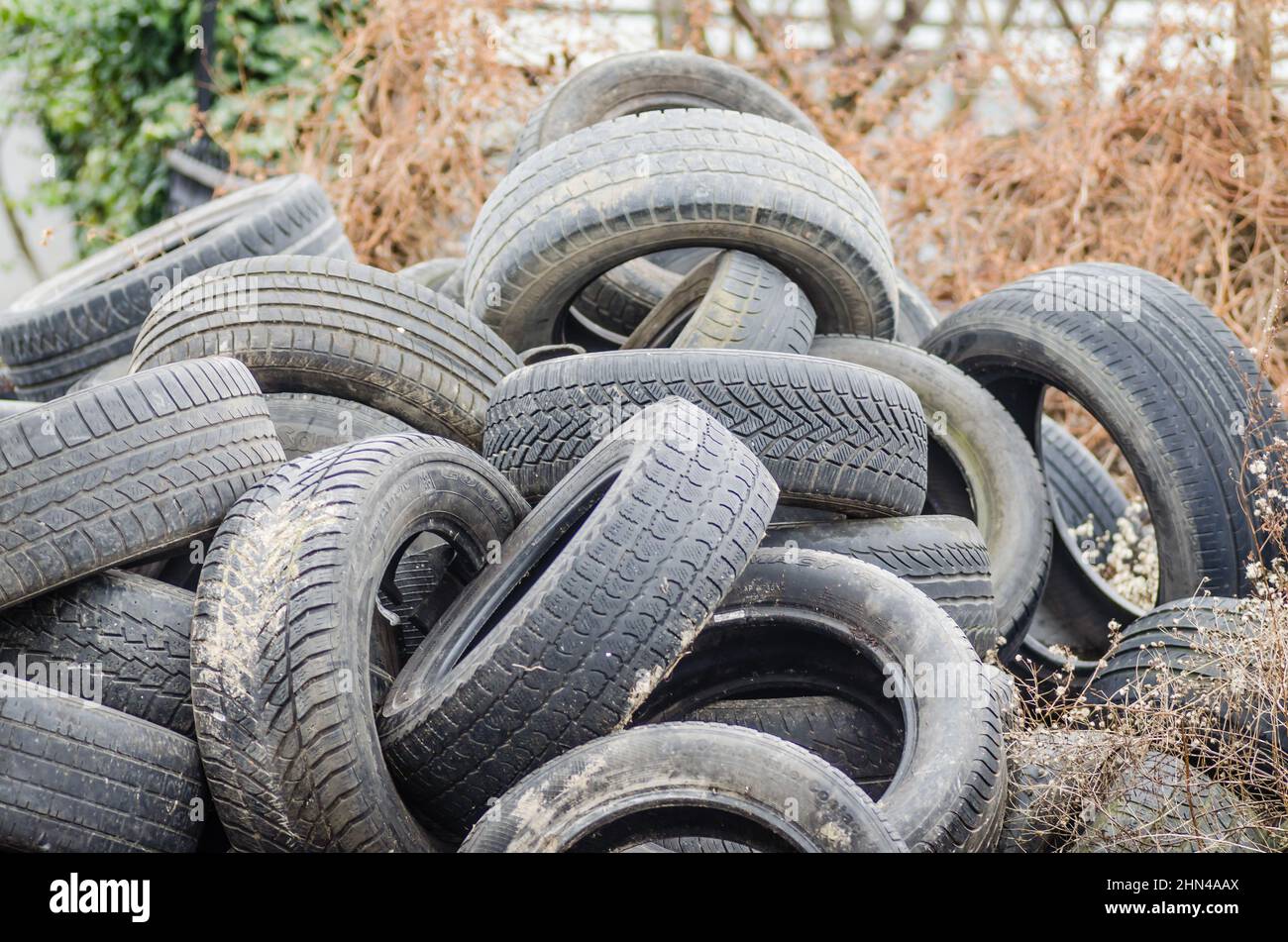 A pile of damaged, old, discarded, car tires for recycling Stock Photo - Alamy