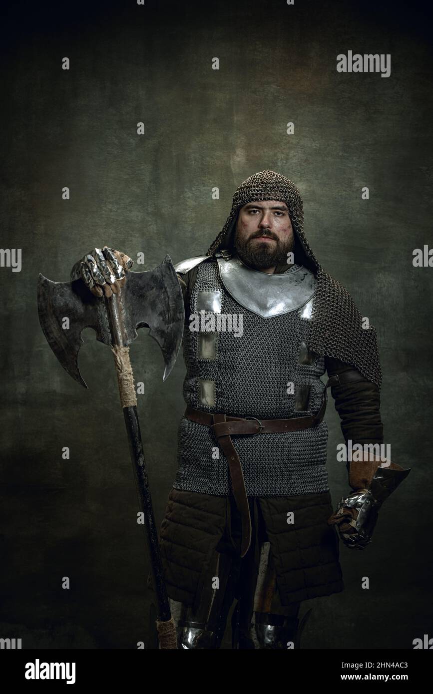 Vintage portrait of brutal seriuos man, medieval warrior or knight with ...