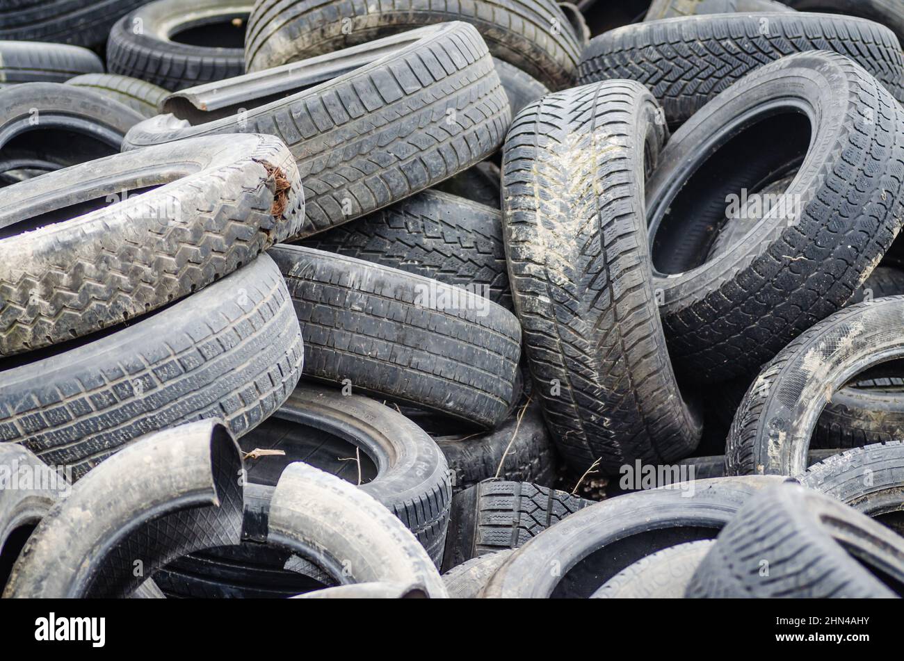 A pile of damaged, old, discarded, car tires for recycling Stock Photo ...