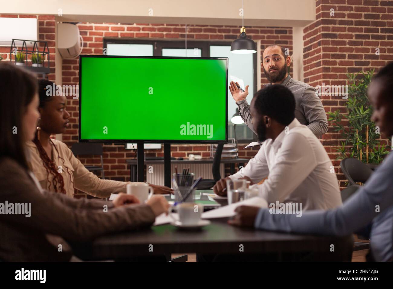 Executive manager man explaining marketing strategy using mock up green ...