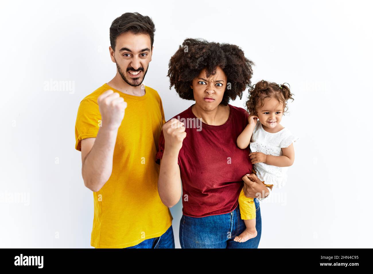 Interracial young family of black mother and hispanic father with ...