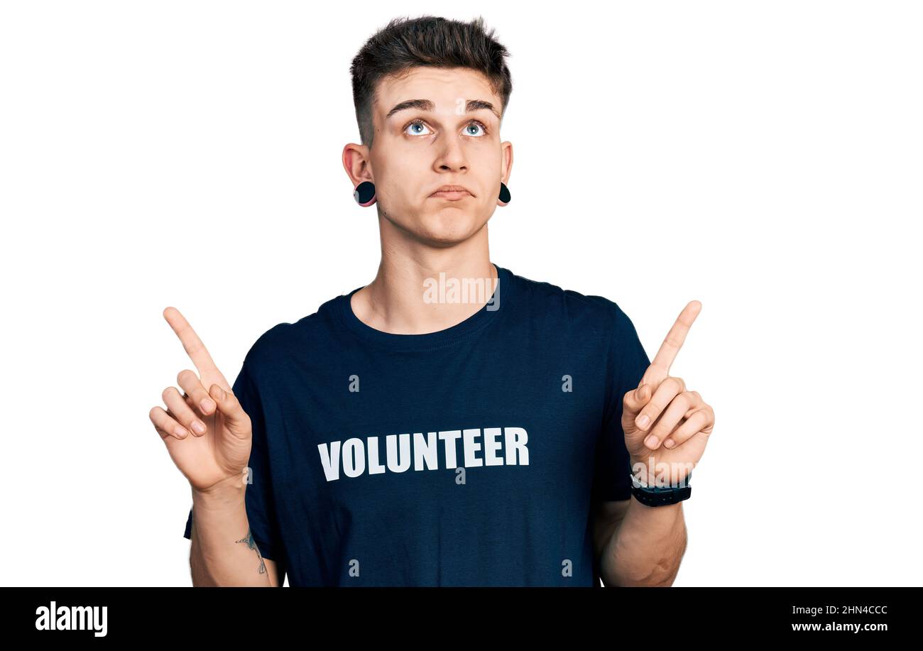 Young caucasian boy with ears dilation wearing volunteer t shirt ...