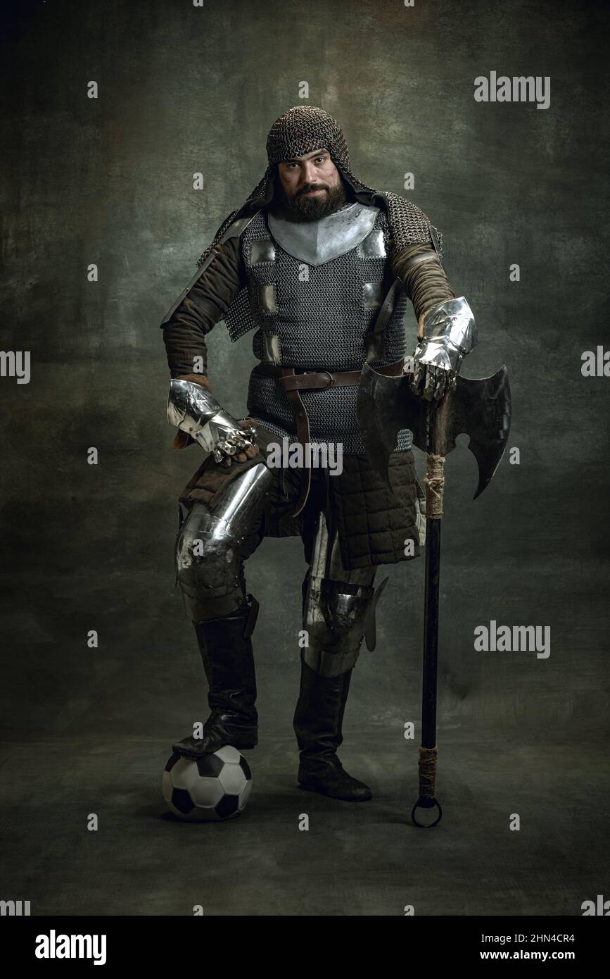 Vintage portrait of brutal seriuos man, medieval warrior or knight with ...