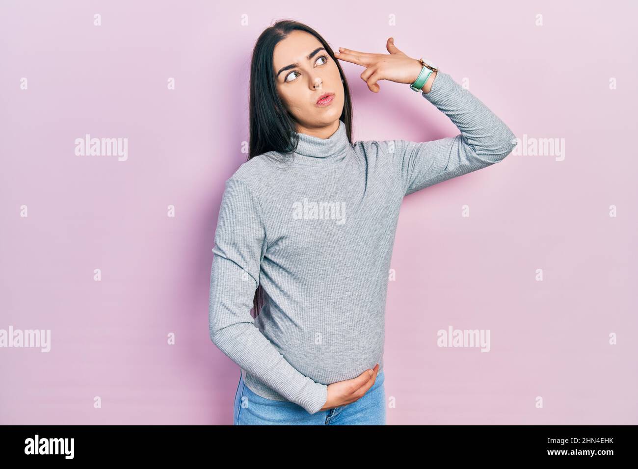 Beautiful woman with blue eyes expecting a baby, touching pregnant ...