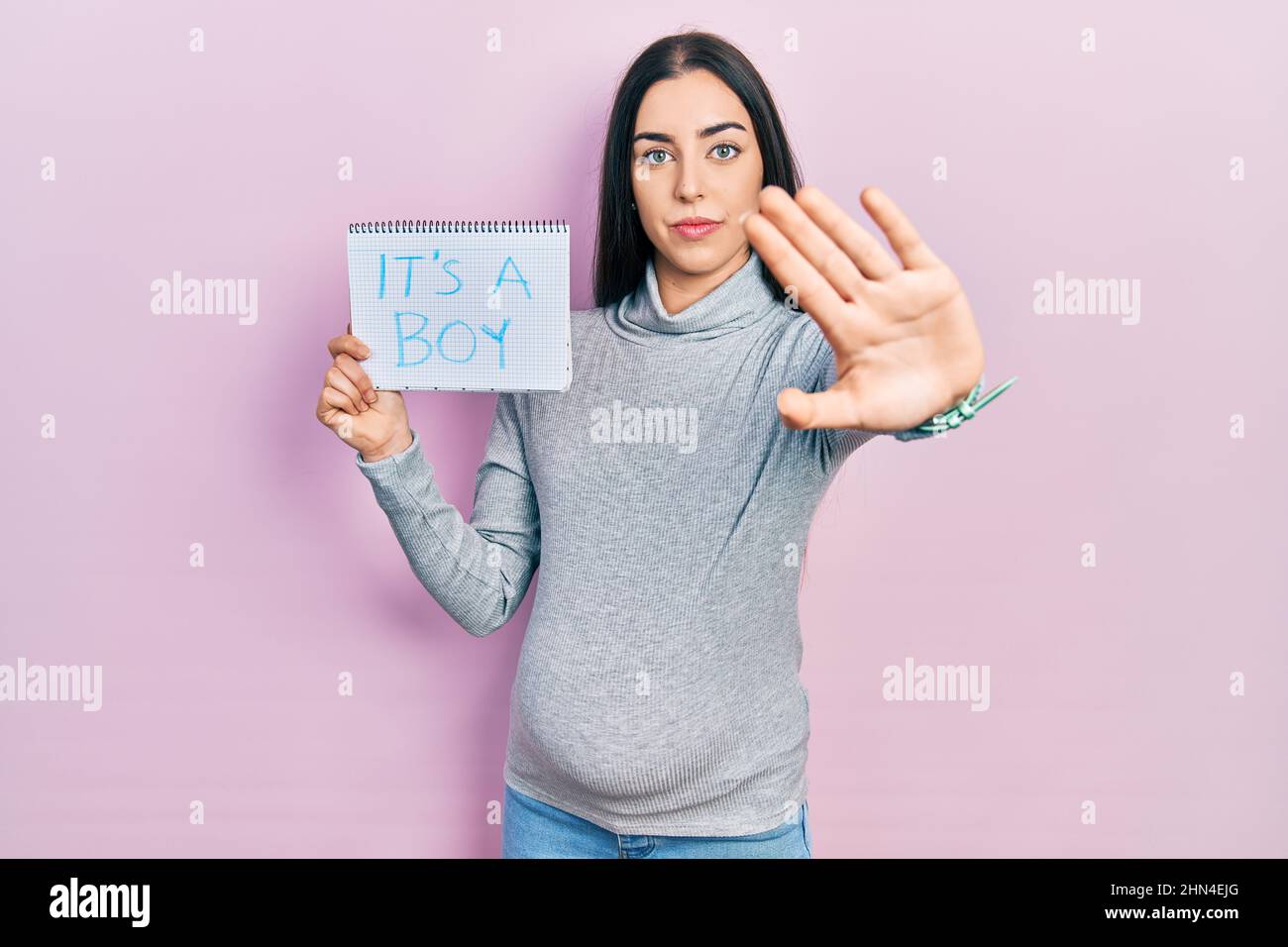 Beautiful woman with blue eyes expecting a baby holding its a boy ...