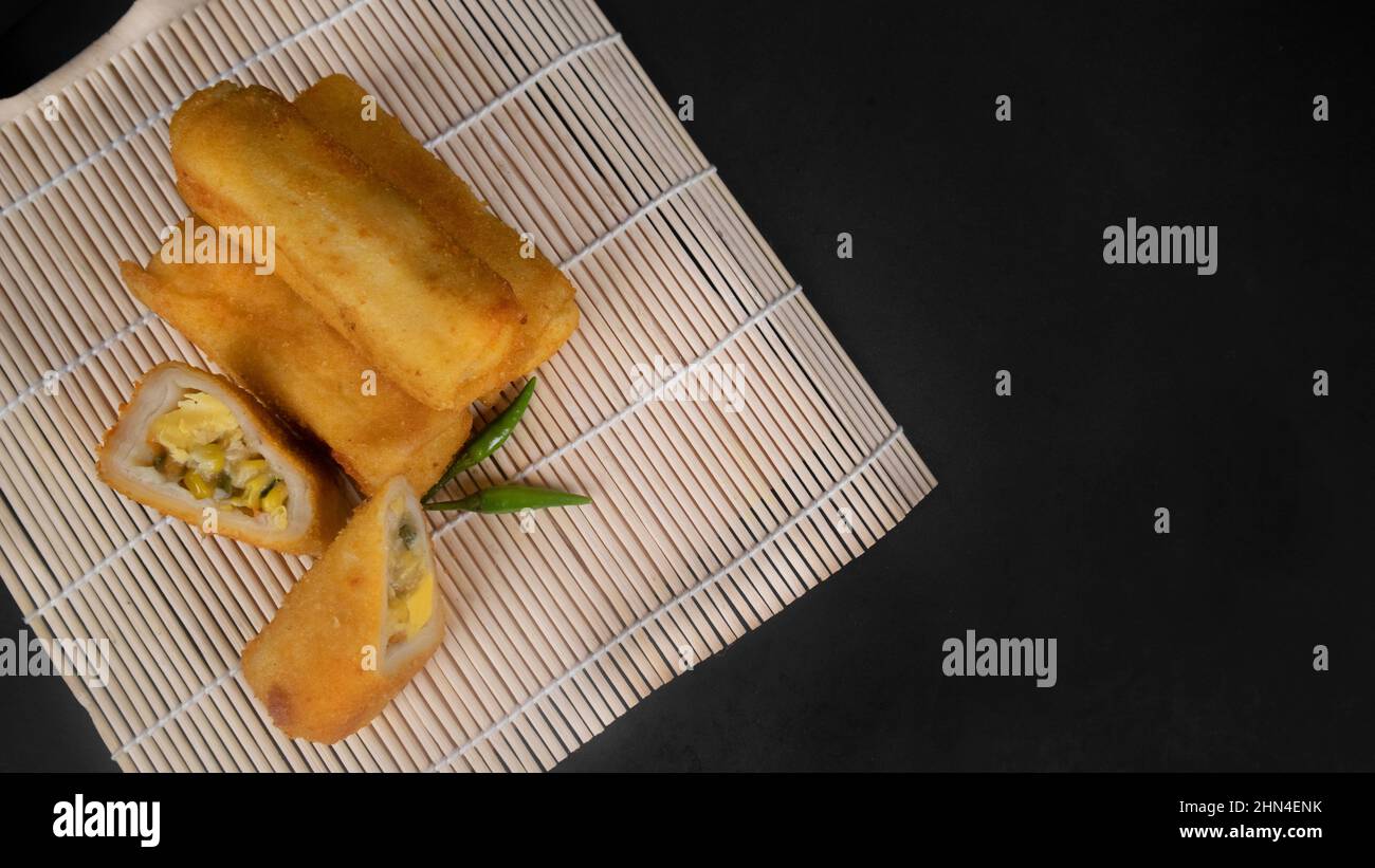 top view sliced Indonesian Rissoles on a black background Stock Photo ...