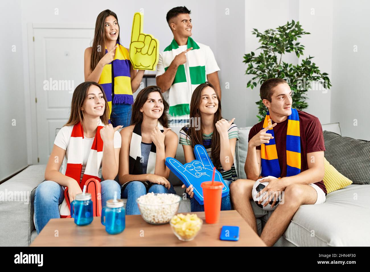 Group of people football hooligan cheering game pointing thumb up to ...