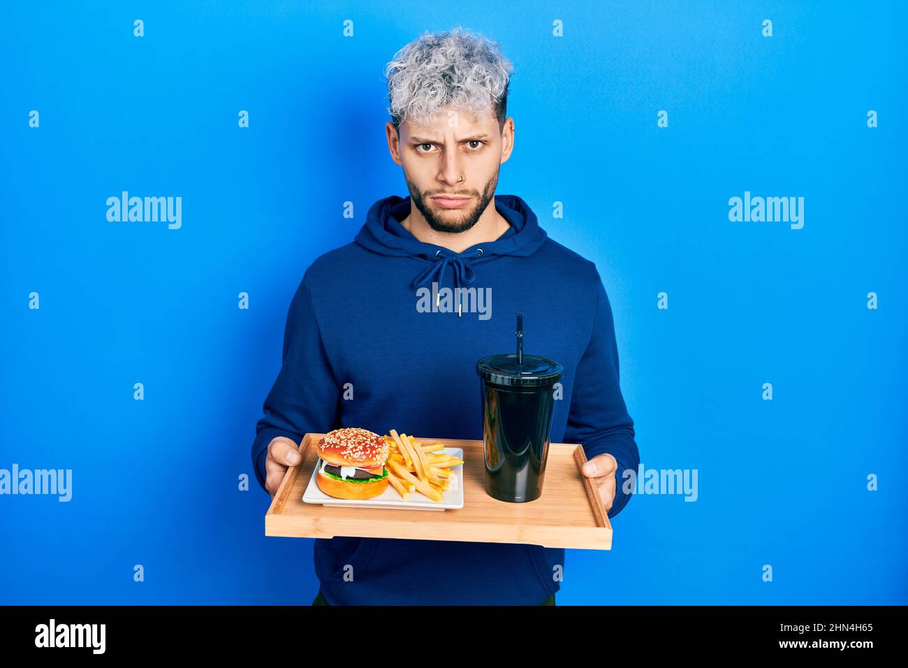 Nervous person eating hamburger hi-res stock photography and images - Alamy