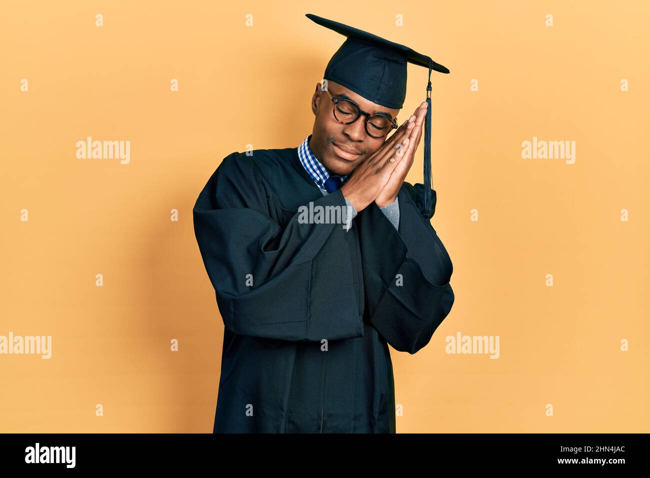 Young african american man wearing graduation cap and ceremony robe ...