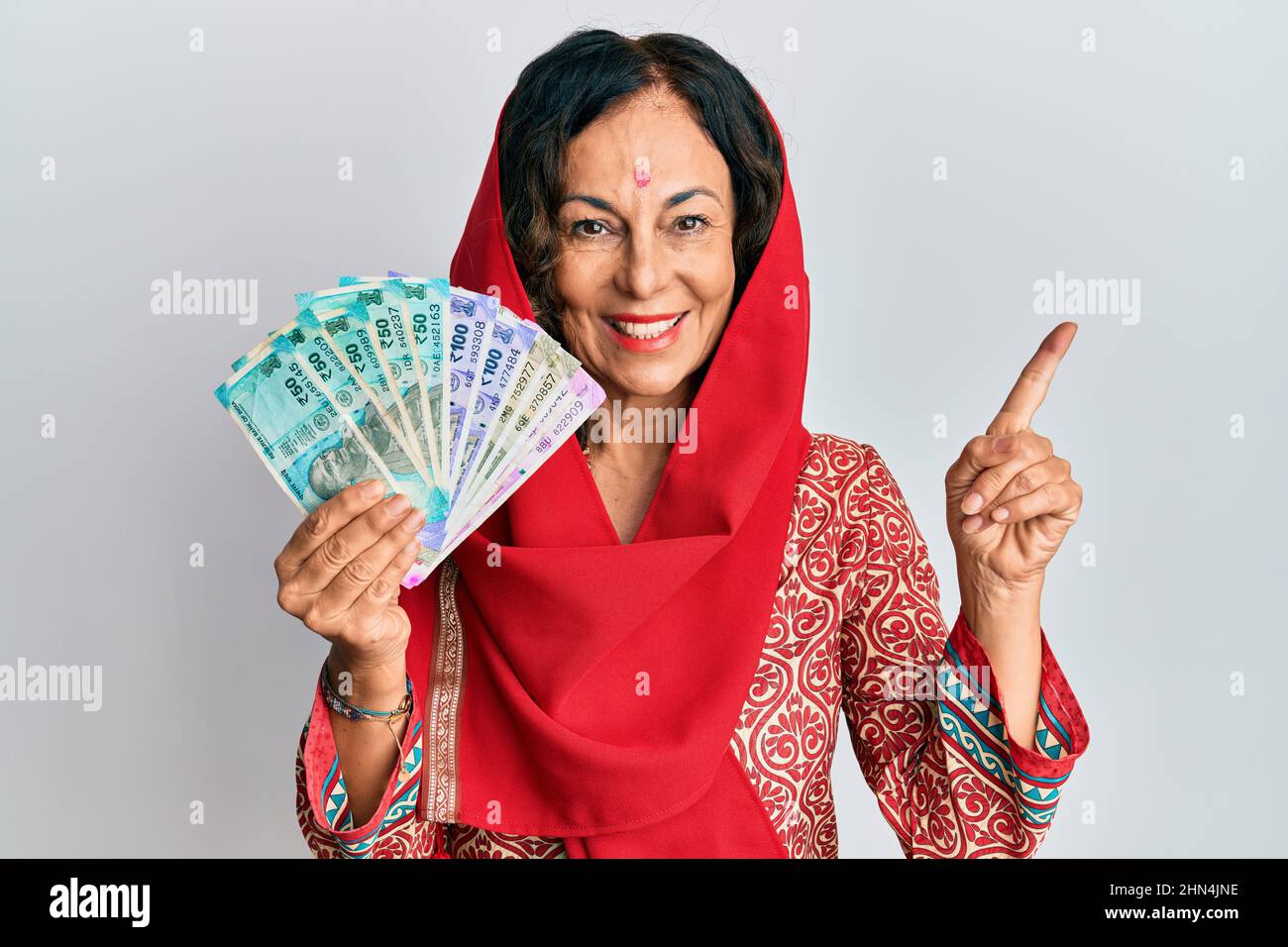 Middle age hispanic woman wearing traditional indian clothes and ...