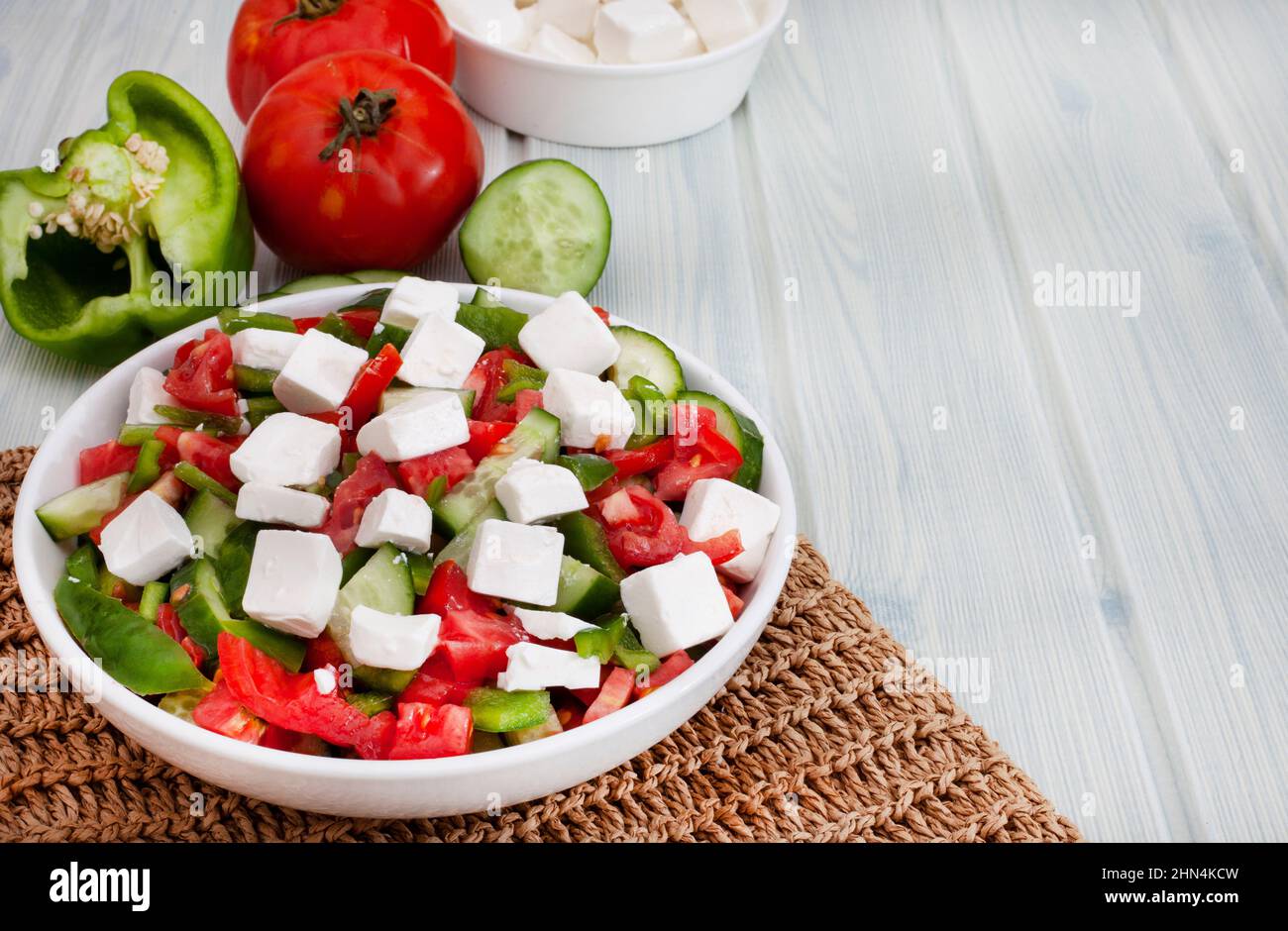 Simple Bulgarian Shopska type salad with tomato, cucumbers, peppers and ...