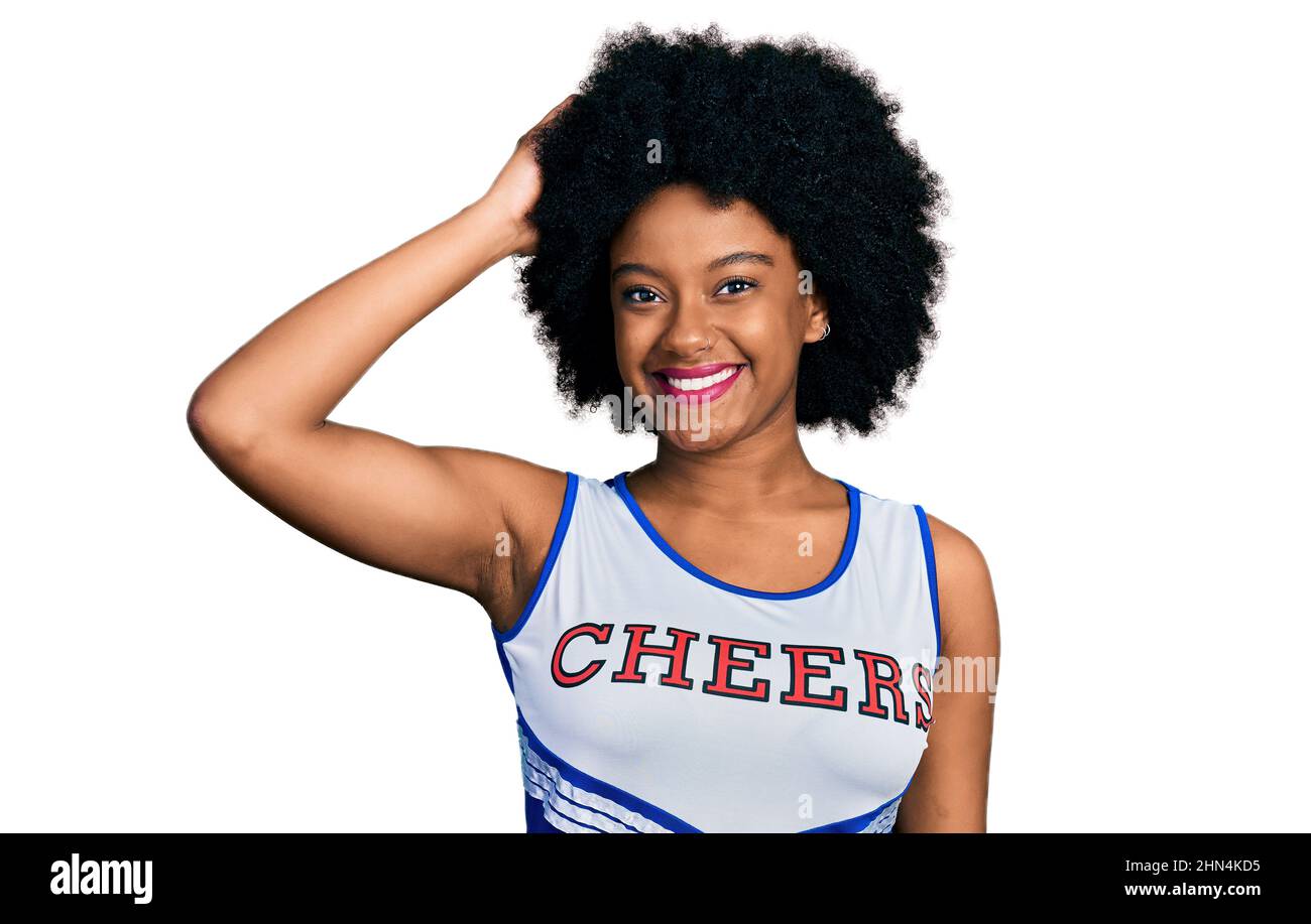 Young african american woman wearing cheerleader uniform confuse and ...