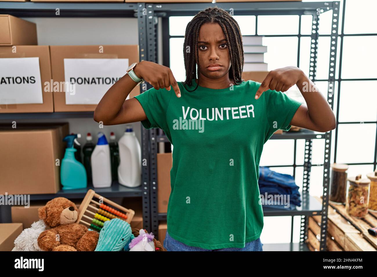 Young african american woman working wearing volunteer t shirt at ...
